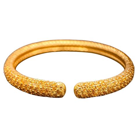A 12 Carats Pave Set Fancy Yellow Diamond Bangle 9mm Width For Sale