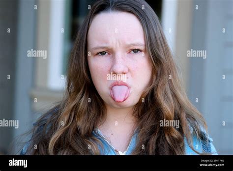 Young Girl Angry Teenager Stuck Out Her Tongue Looks Into Frame Close
