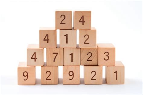 Premium Photo A Stack Of Wooden Blocks With Numbers And Numbers On Them