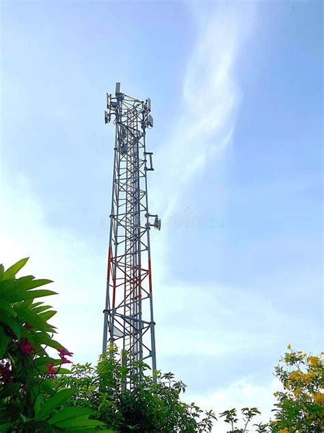 Mobile Phone Base Station Of Wireless Communications With Tree Cloud And Blue Sky In Thailand