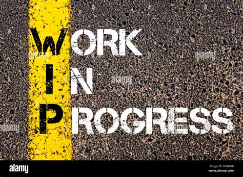 Concept Image Of Business Acronym WIP Work In Progress Written Over Road Marking Yellow Paint