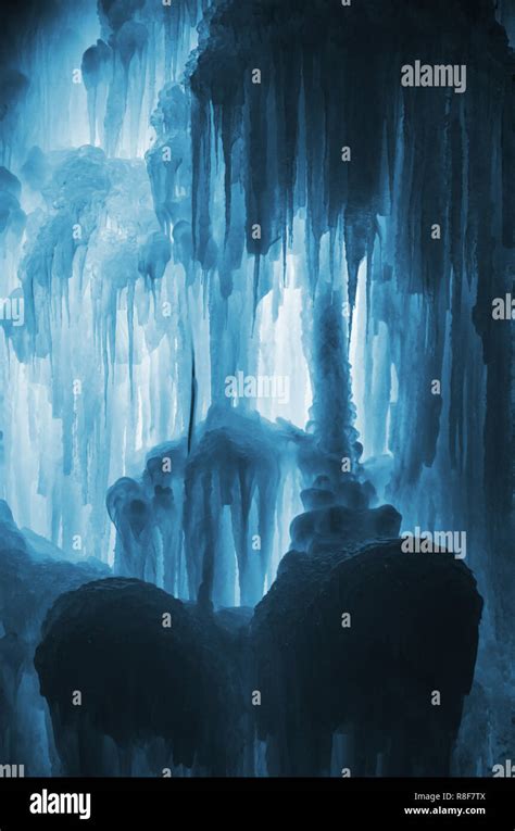 Huge ice icicles. Large blocks of ice frozen waterfall or water. Blue ...