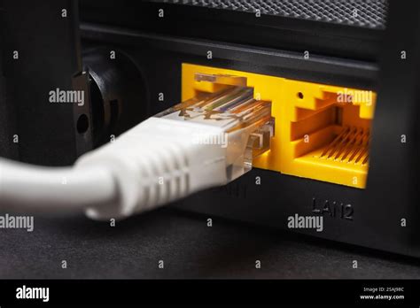 Connect An Ethernet Cable To A Wireless Router On Dark Ethernet Rj45 And Electric Cables