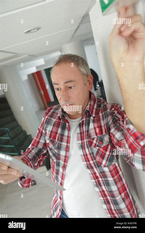Man Testing Security Exit Light Stock Photo Alamy