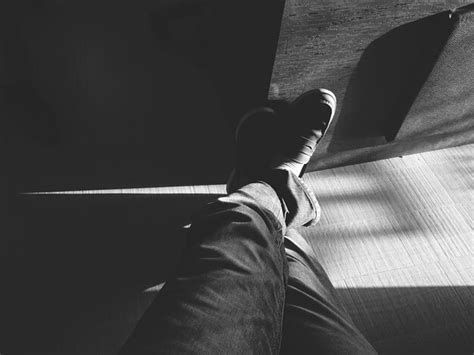 Premium Photo Low Section Of Man With Legs Crossed At Ankle Resting At Home