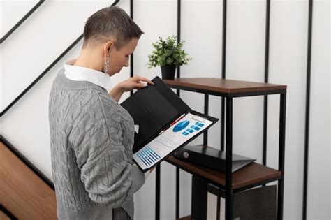 Premium Photo Woman Checking Documents In A Folder In A Stylish Office