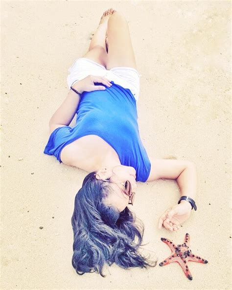 Premium Photo High Angle View Of Woman Lying On Sand At Beach