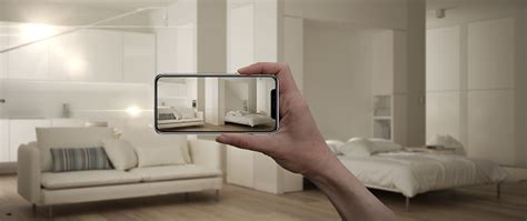 손을 잡고 스마트 폰 Ar 응용 프로그램 실제 가정에서 가구 및 인테리어 디자인 제품을 시뮬레이션 건축가 디자이너 개념 배경 흐림 현대 원 룸 아파트 Brand Name