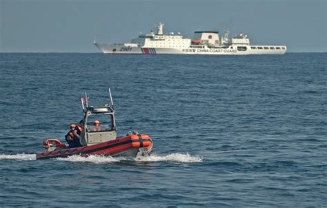 A Uscg Cutter Monitored By A Ccg Zhaotou Class Patrol Vessel In The