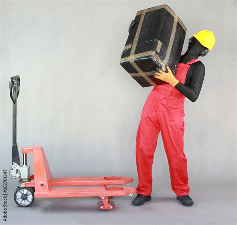 Anonymous Worker Dealing With Heavy Package At Manual Pallet Truck Correct Body Position