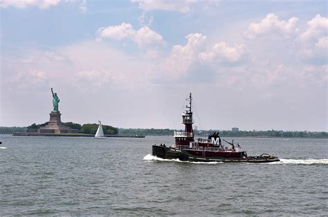 Statue Of Liberty In Front Of Boat In Sea New York Photograph By Lukas