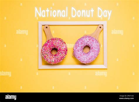 National Donut Day Donuts With Pink Icing On A Yellow Background