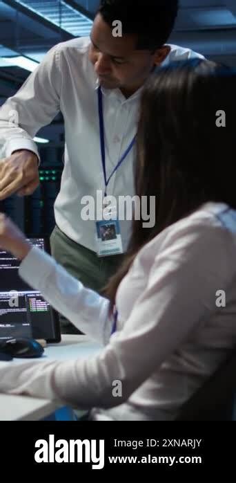 Vertical Video Engineering Team Colleagues In Data Center Managing Gear Energy Consumption