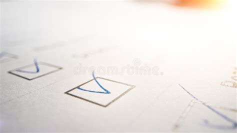 Person Ticks Checkbox Marks With A Pen Filling Up To Do List Checking Marks And Filling In A