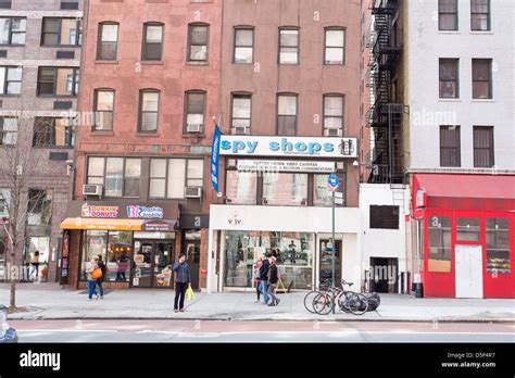 People Walking On The Sidewalk Along The Street Of New York City Ny At