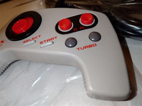 Crispy Pictures Of An Unused 80s Nintendo Nes Max Controller And The Original Japanese Version