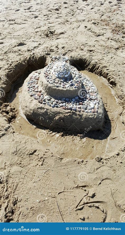 Small Sandcastle With Stones And Shells Stock Image Image Of