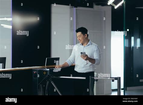 Young Man Asian Programmer Ceo It Specialist Enters Office Through Electronic Turnstile
