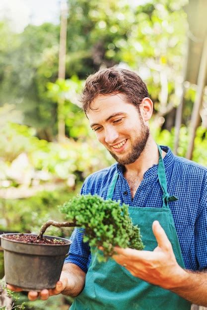 Premium Photo Happy Man With Bonsai Tree