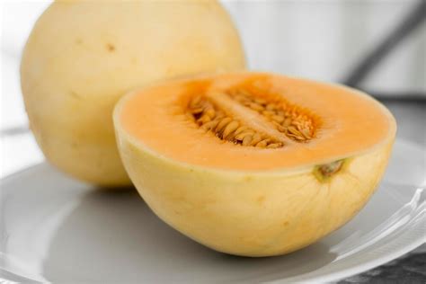Premium Photo Fresh Sweet Orange Melon On The White Plate As A