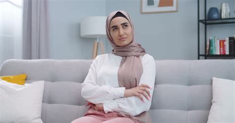 Beautiful Smiling Confident Muslim Woman In Hijab Looking At Camera Posing Alone At Home