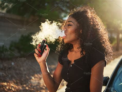 Woman Vaping A Person Photo By Rezart Creative Market