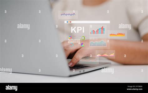 Women Use Laptops To Analyze Key Performance Indicators With Various Graphs And Charts