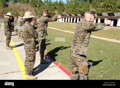 Marines Fire Down Range With The M9 9mm Pistol During Combat Pistol