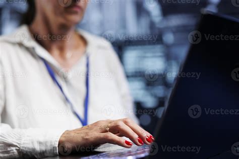 Elderly It Expert In Server Hub Using Laptop Ensuring Valuable Data
