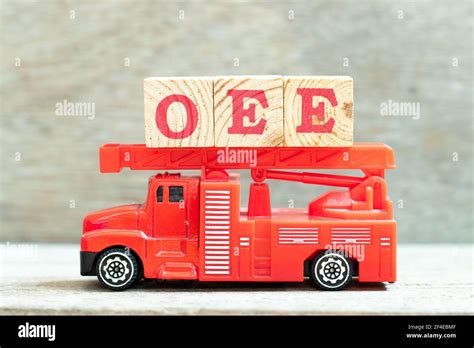 Fire Ladder Truck Hold Letter Block In Word Oee Abbreviation Of Overall Equipment Effectiveness