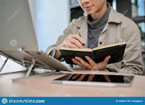 Smart Asian Male Programmer Or Web Developer Concentrating On His Task