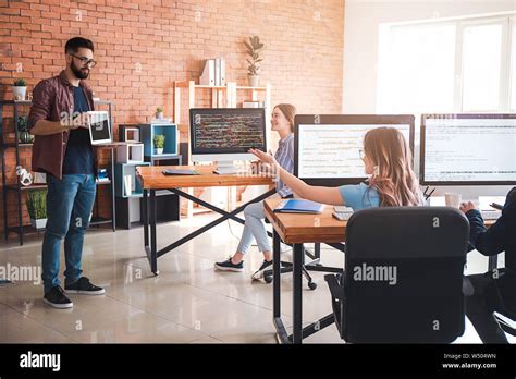 Computer Programmers Discussing Hi Res Stock Photography And Images Alamy