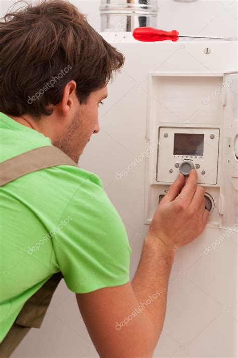 Man Changing Temperature Setting Stock Photo Photographee Eu 45931443