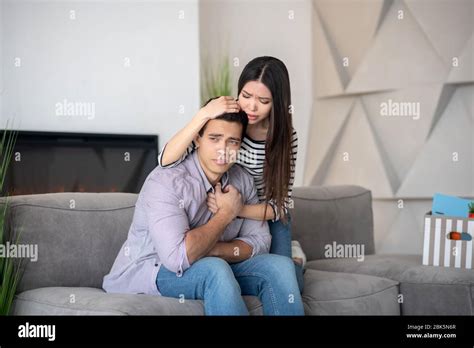 Unhappy Lost Man And Understanding Pretty Wife Stock Photo Alamy