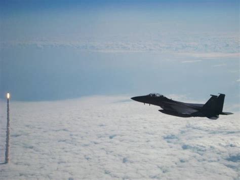 F 15E Strike Eagle Flies As The Shuttle Endeavor Launches For The Last Time In May 2011
