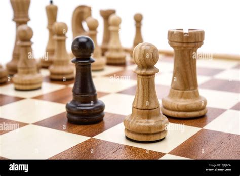 beige brown wooden chess different pieces figures standing on chessboard close up game concept