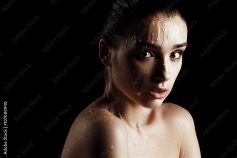 Beauty Portrait Of Young Woman With Strobing Makeup Liquid On Face Wet Body Effect Strobing