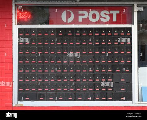 Dirty And Faded Australia Post PO Boxes Outside A Shop In The Suburbs Of Melbourne Stock Photo