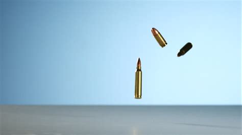 Bullets Falling And Bouncing In Ultra Slow Motion Fps On A Reflective Surface BULLETS
