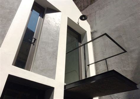 Perforated Brick Gable Screens Courtyard In Front Of Compact Hanoi House