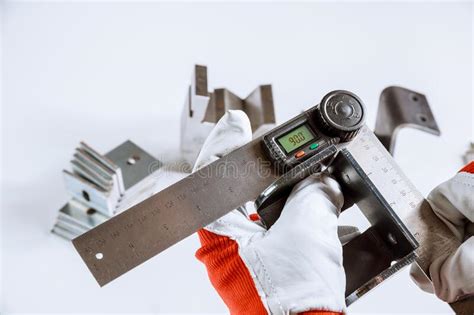 Accurate Measurement Of Metal Parts On A White Background With A