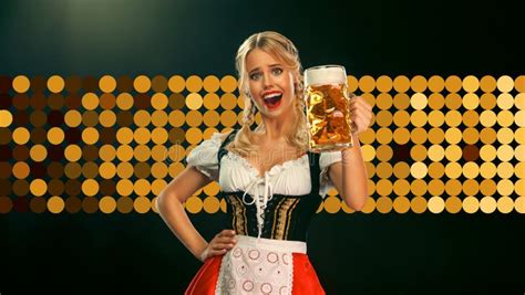 Beer For Oktoberfest From Girl In Traditional German Dirndl