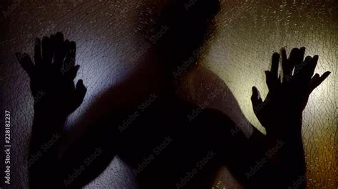 Silhouette Of Couple Of Lovers Are Having Sex View Through Transparent Plastic Screen Stock