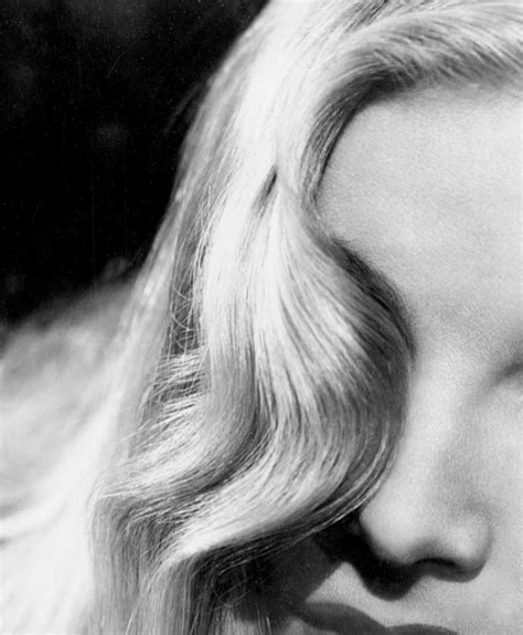 Veronica Lake Demonstrating How Her Peek A Boo Hairdo Could Get Caught
