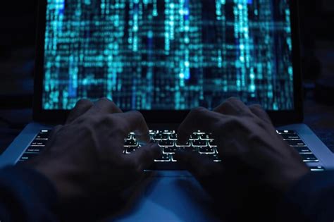 Premium Photo Man Typing Code To Unlock Laptop In Dark Room