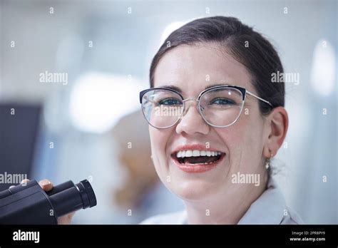 The Search Of A Lifetime A Young Female Lab Tech Using Her Microscope