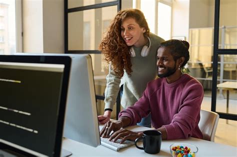 Premium Photo Couple Of Programmers Working In Team