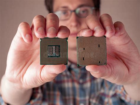 Hand Holding Cpu Modules To Assemble A Computer Choosing The Right Components For A Computer