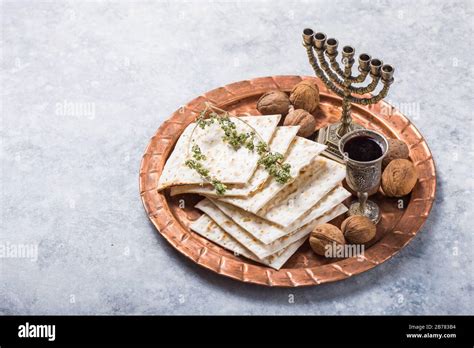 Passover The Feast Of Unleavened Bread Matzah Bread And Red Wine Glasses On The Shinny Round