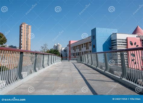 A Pedestrian Overpass Composed Of Stone Slabs And Guardrails Stock
